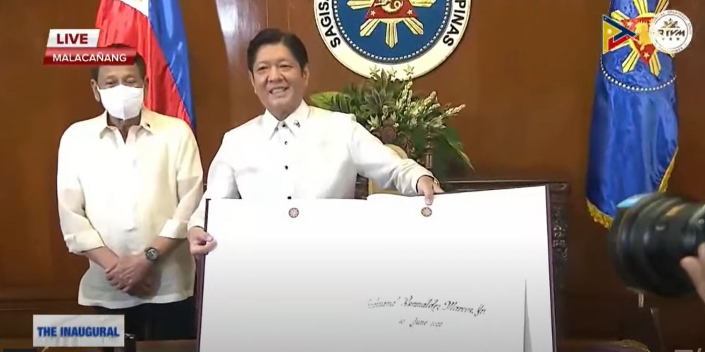 Marcos Jr shows his signature - Eagle News