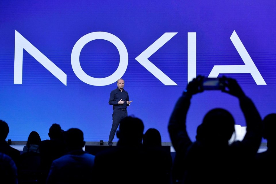 Nokia signals lower customer spending after mixed results